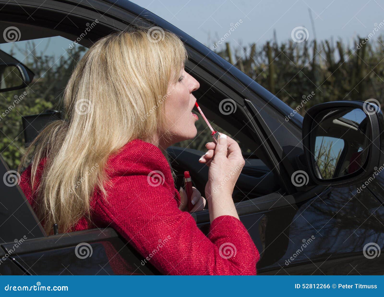 Female Motorist Applying Makeup Stock Photo - Image of blonde, wing ...