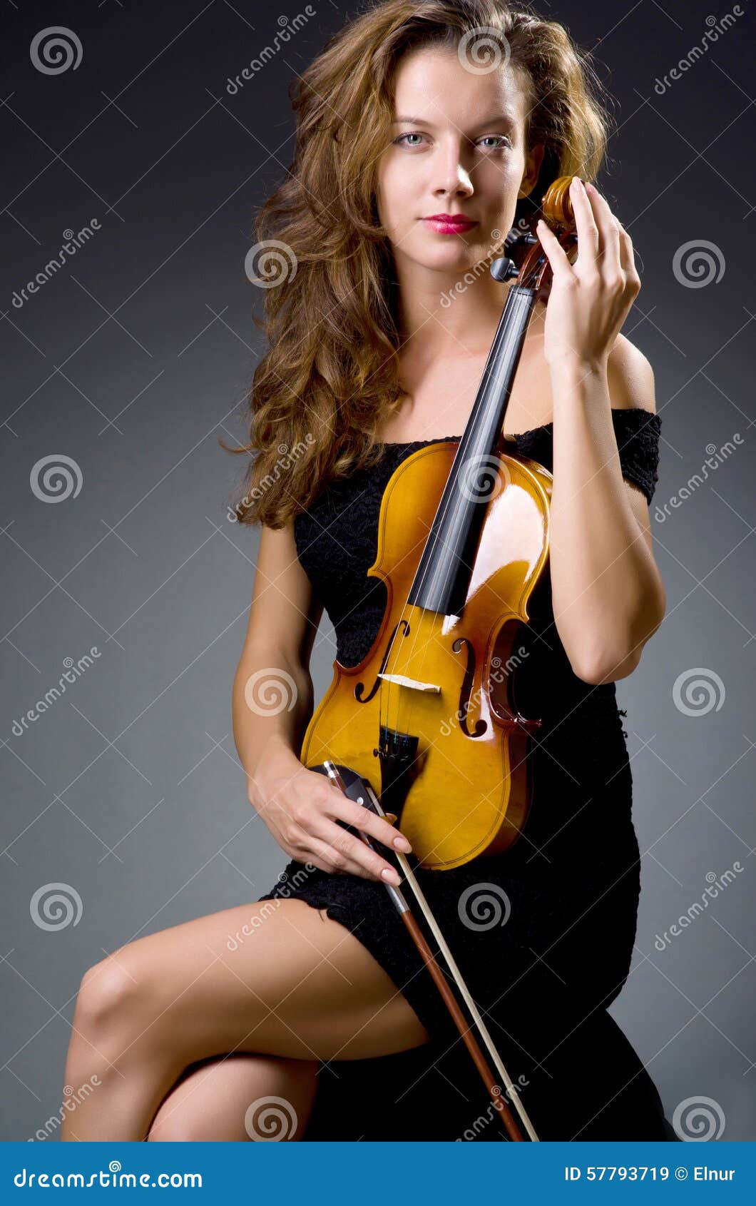 Female Musical Player Against Dark Background Stock Image - Image of ...