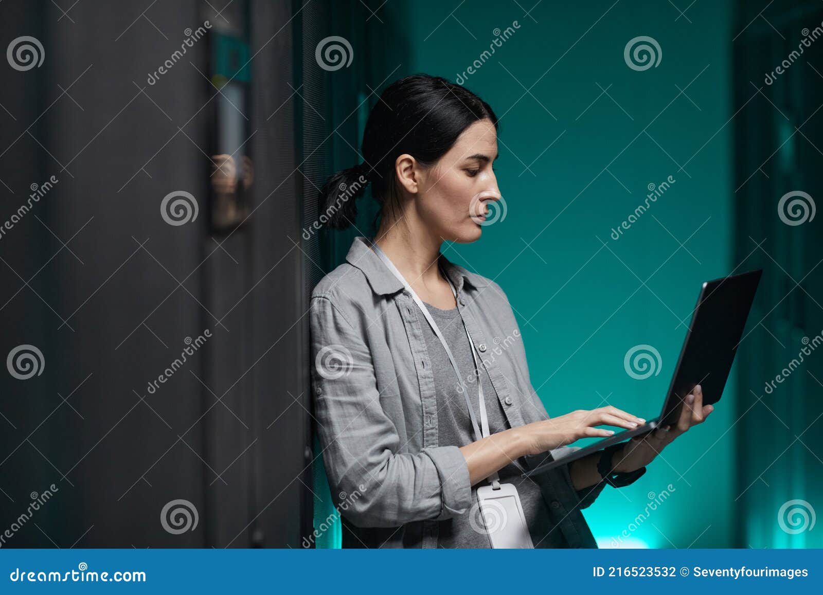 Female Network Engineer Using Laptop Side View Stock Photo - Image of ...