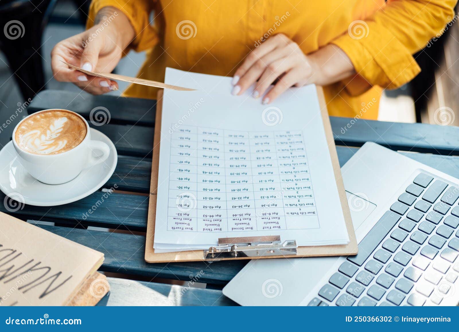 Female Numerologist Hand Working with Numerology Tables with Numbers ... Female Numerologist Hand Working with Numerology Tables with Numbers ...