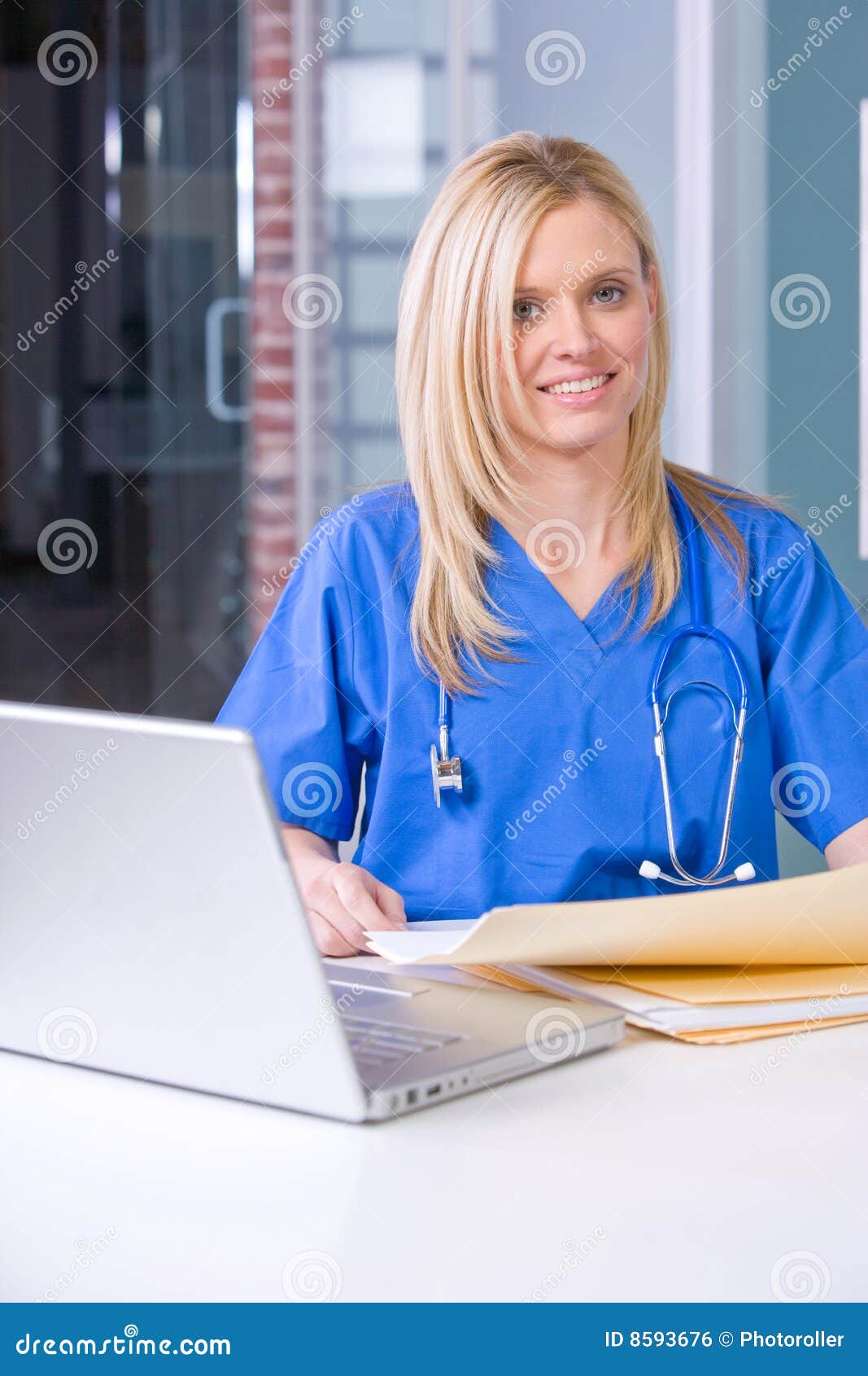 Female nurse at a desk stock photo. Image of portrait - 8593676