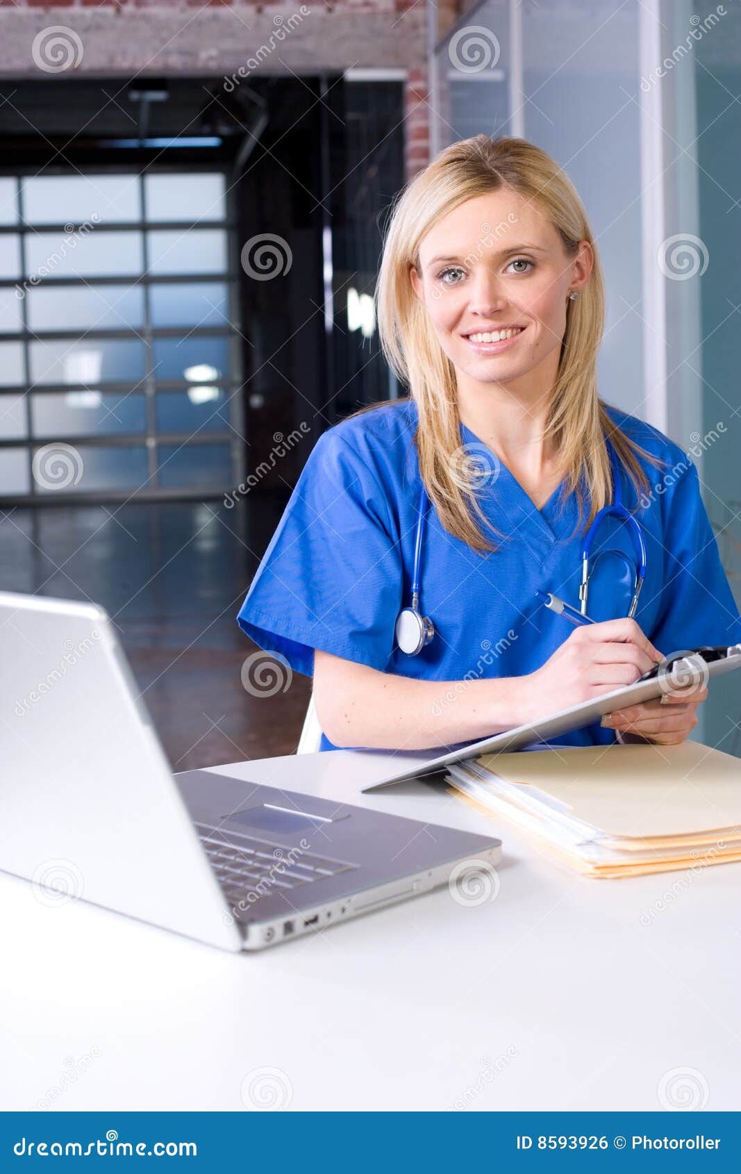 Female nurse at a desk stock photo. Image of beautiful - 8593926