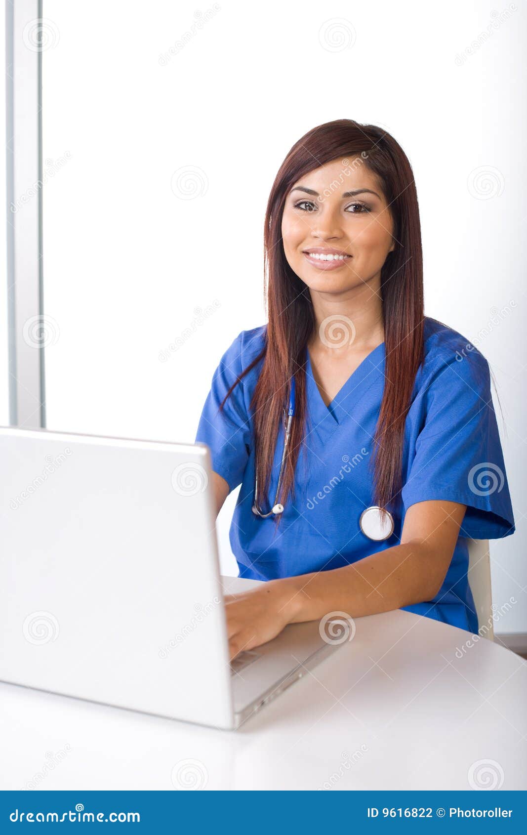 Female nurse at a desk stock photo. Image of hospital - 9616822