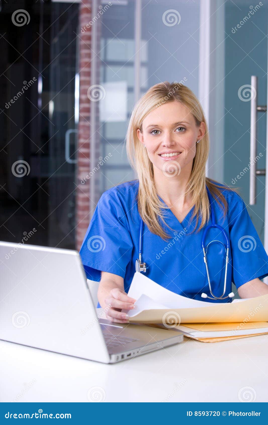 Female Nurse at a Desk Working Stock Photo - Image of human, laptop ...