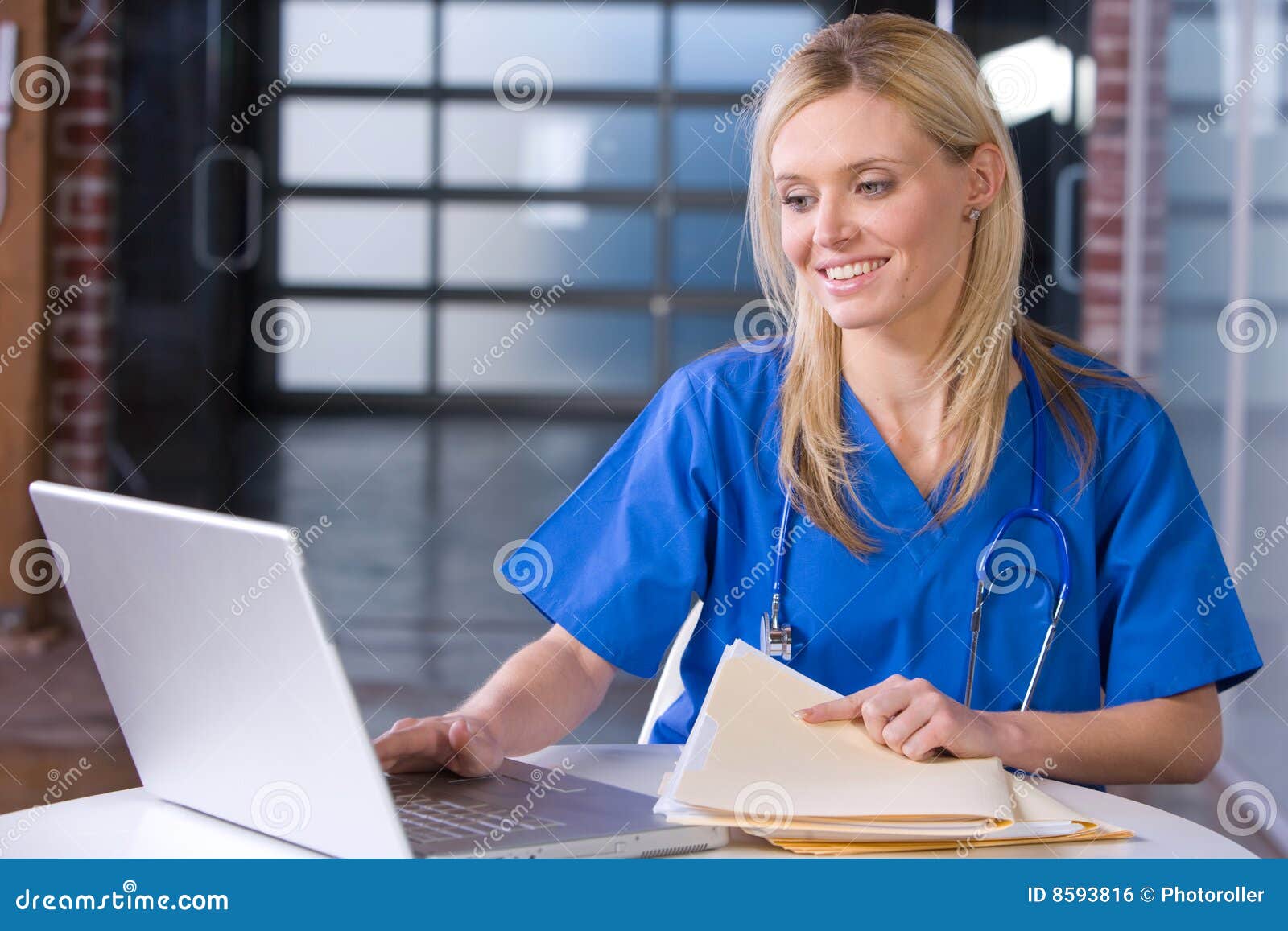 Female Nurse at a Desk Working Stock Photo - Image of beautiful, happy ...