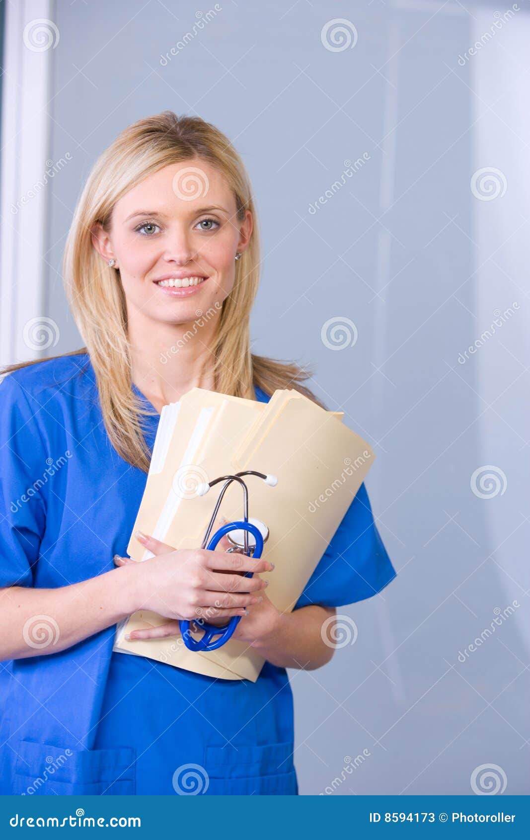 Female Nurse at a Desk Working Stock Image - Image of holding, natural ...