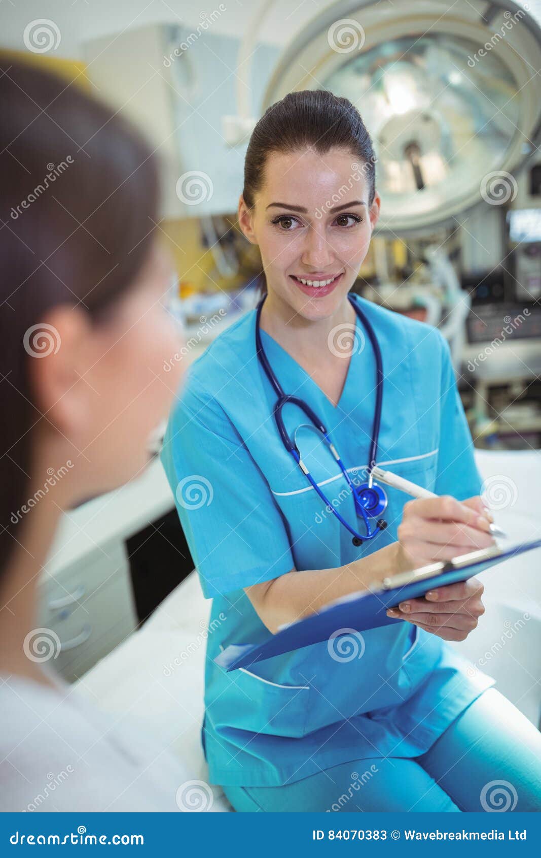 Female Nurse Writing On Clipboard Stock Image Image Of Female Healthcare 84070383