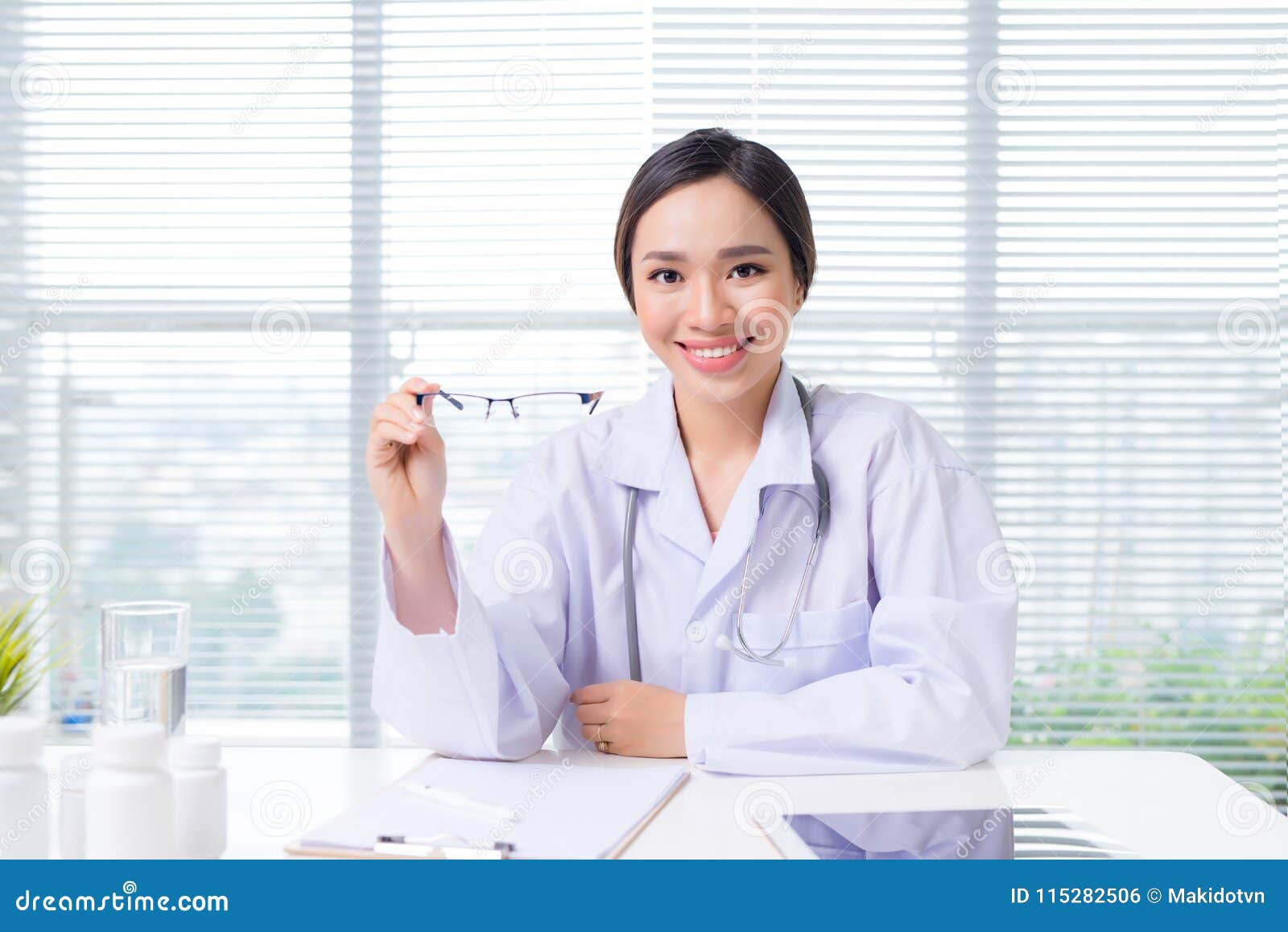 Female Oculist With Eye Chart And Glasses Stock Photo | CartoonDealer ...