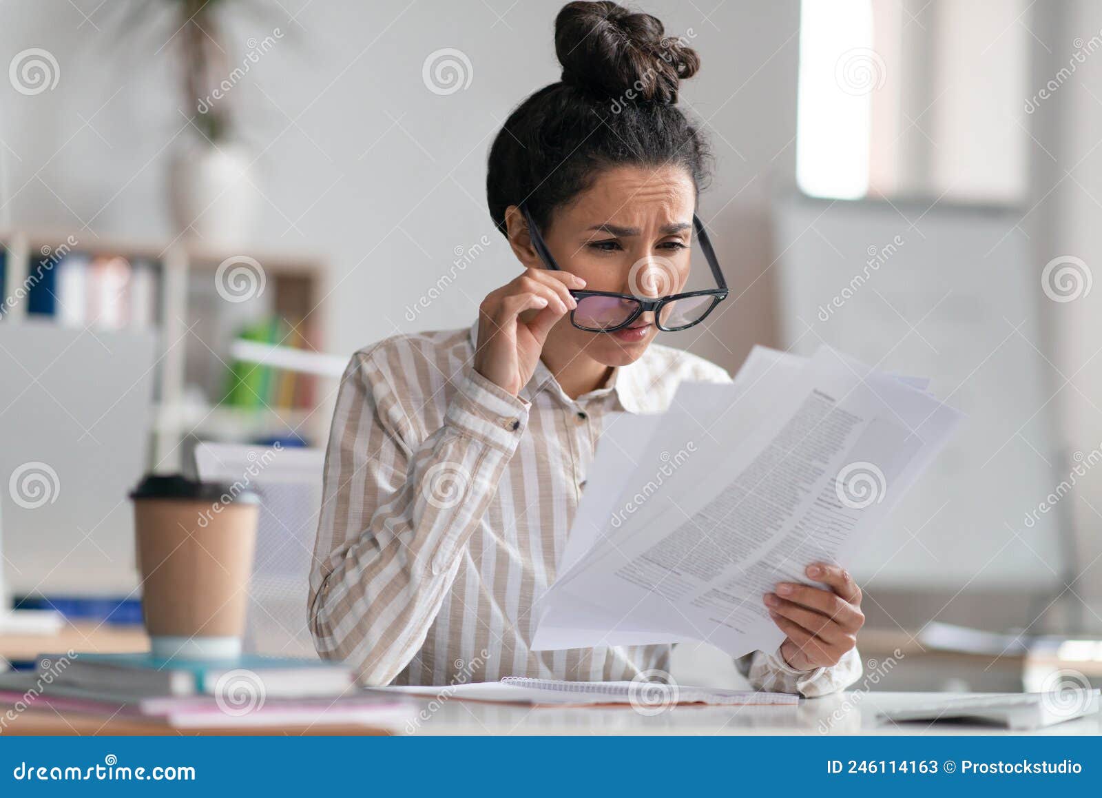 Female Office Manager Wearing Eyeglasses and Doing Paperworks, Having ...
