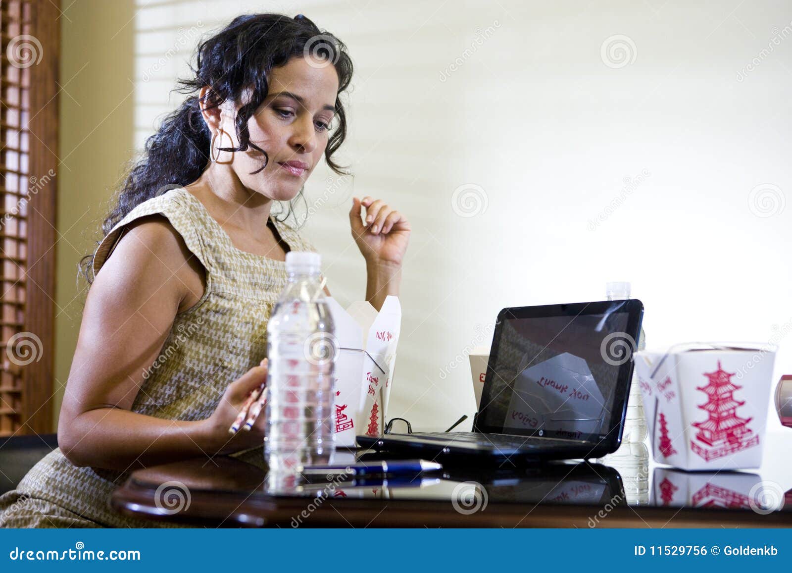 Female Office Worker Eating Takeout Working on La Stock Photo - Image ...