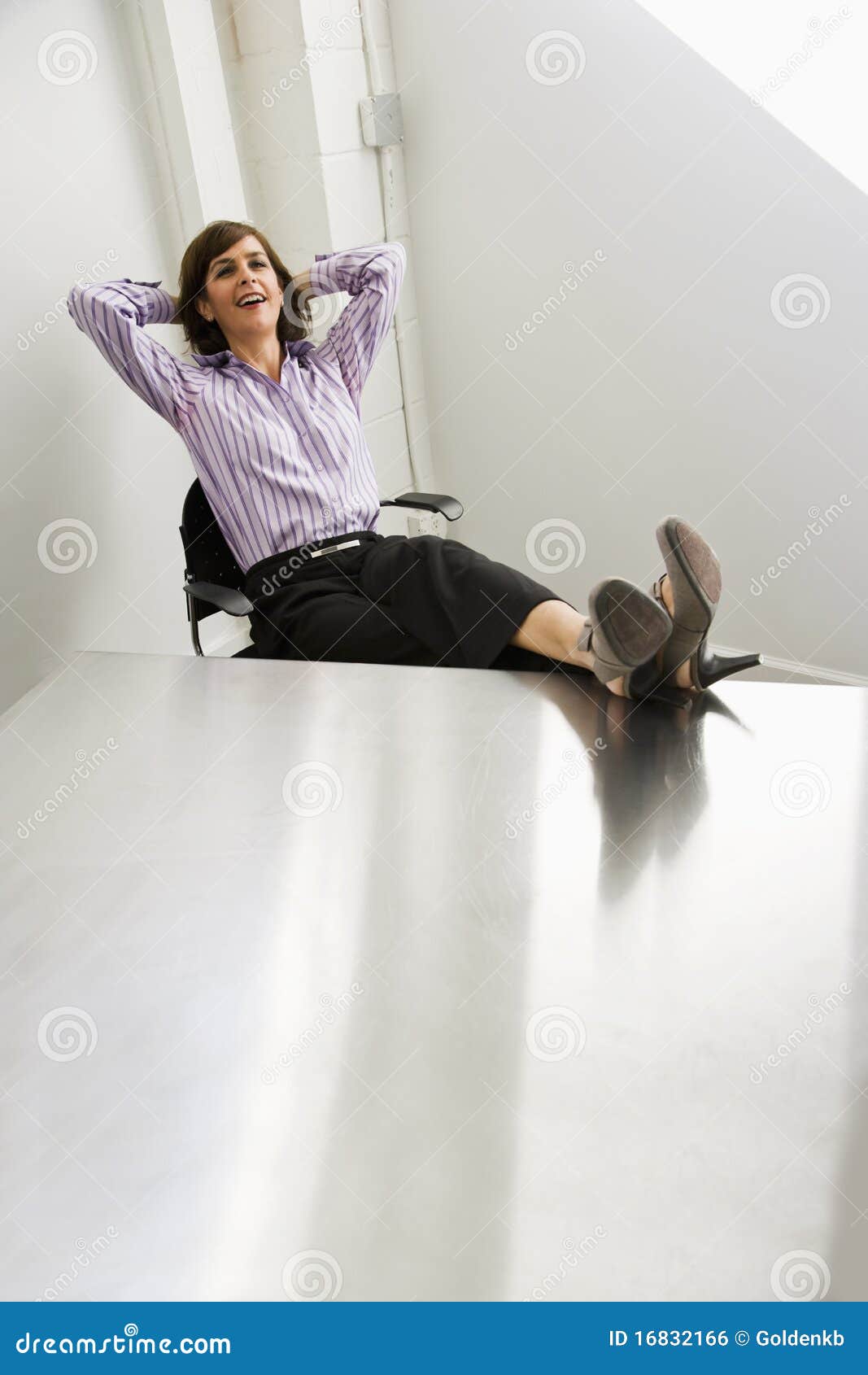 Female Office Worker Relaxing, Feet Up on Table Stock Photo - Image of ...
