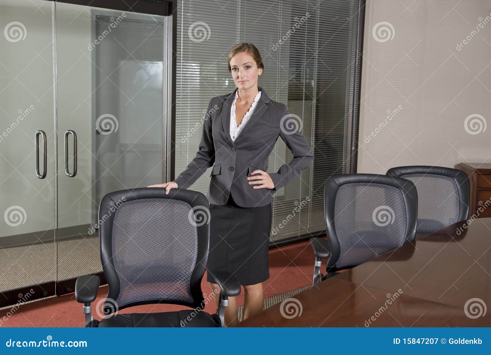 Female Office Worker Standing in Boardroom Stock Image - Image of ...