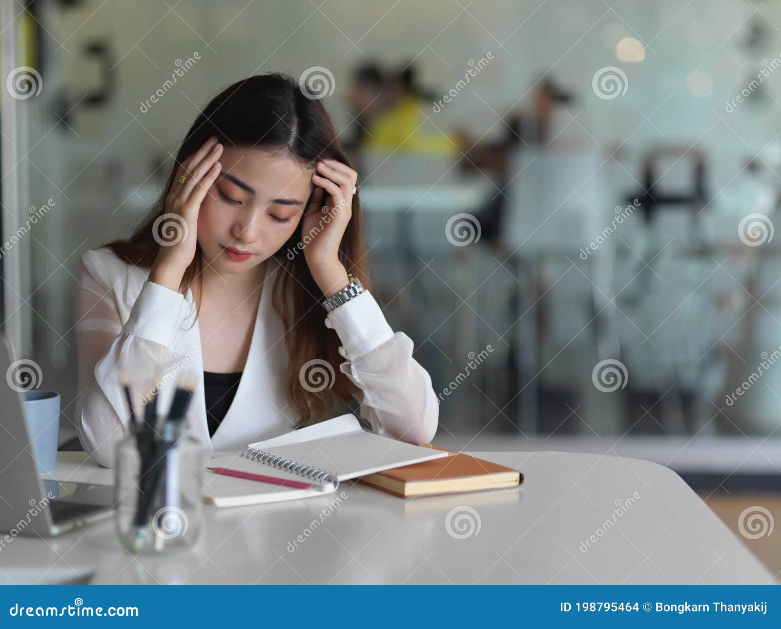 Female Office Worker Thinking about Her Work while Sitting at Worktable ...