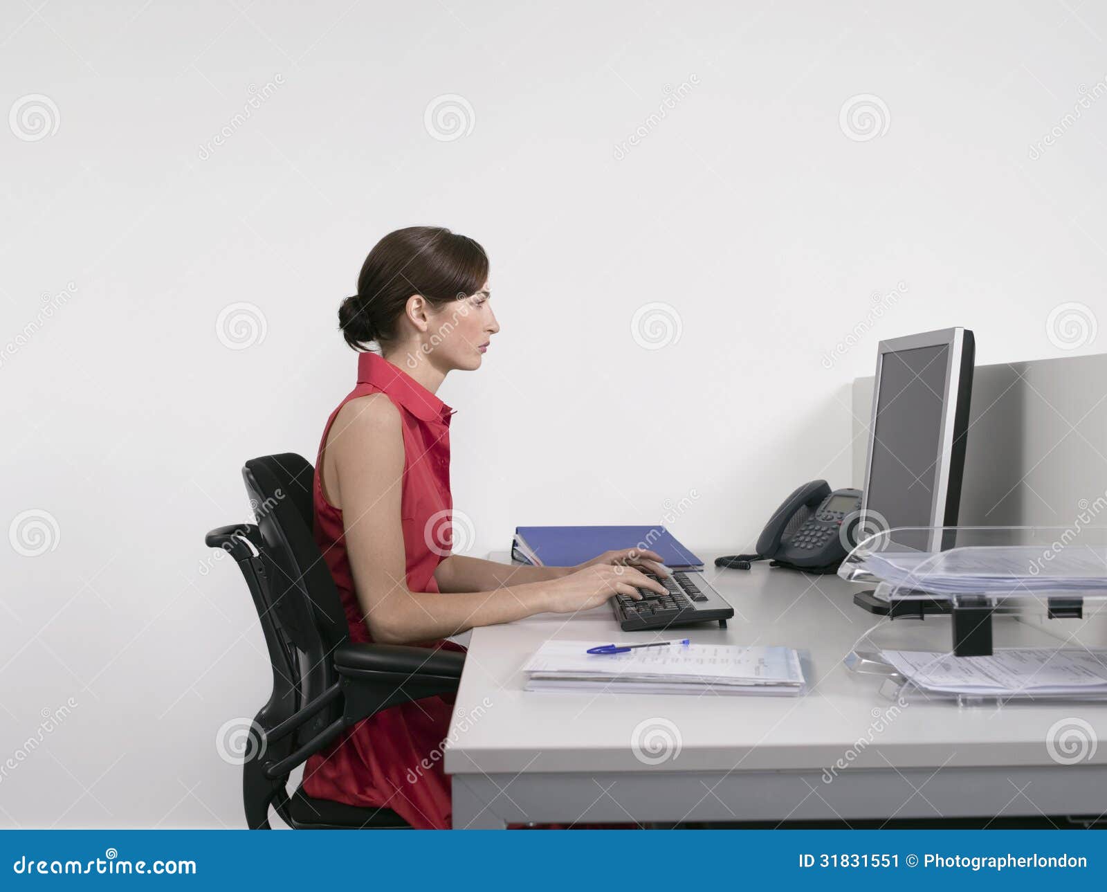 Female Office Worker Using Computer at Desk Stock Image - Image of ...