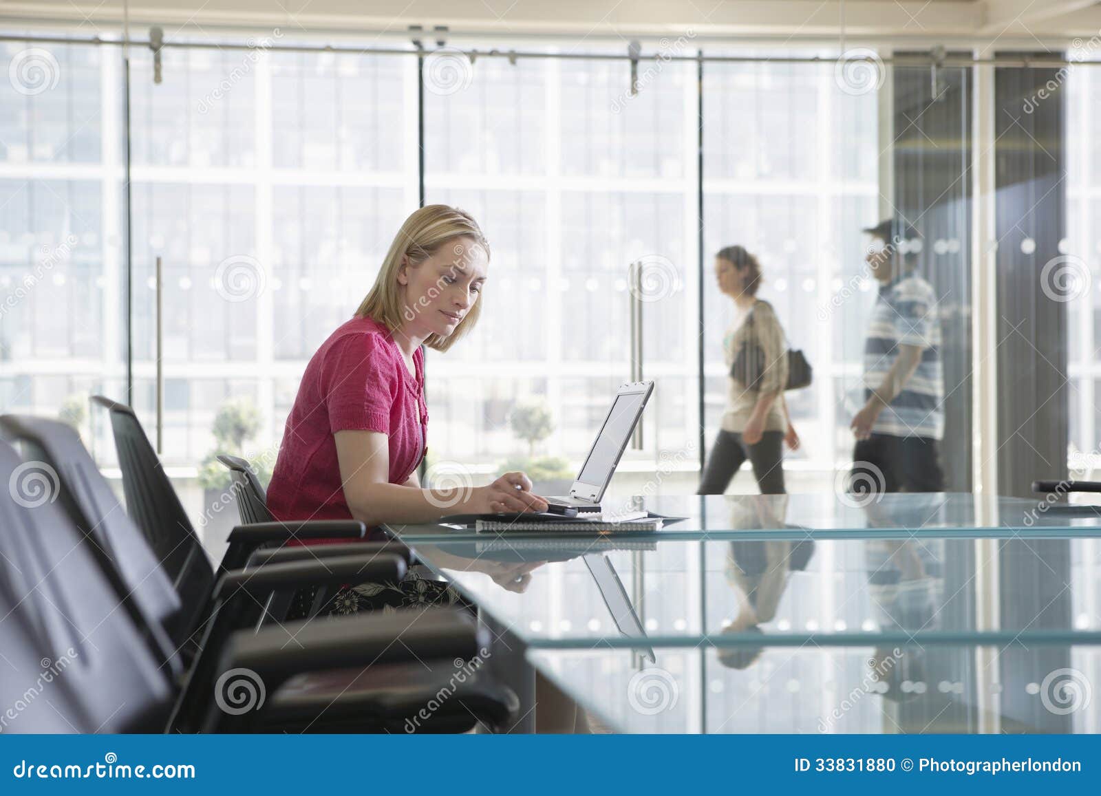 Female Office Worker Using Laptop in Conference Room Stock Photo ...