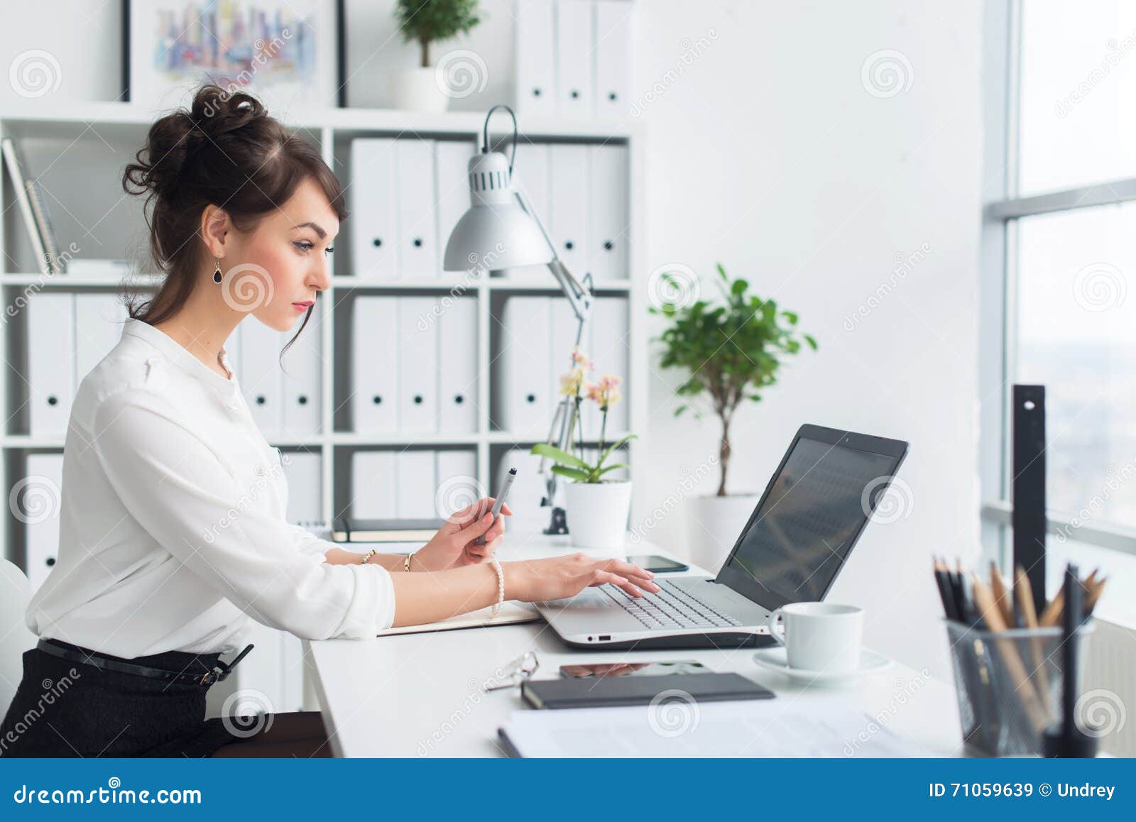 Female Office Worker Using Laptop at Her Workplace, Browsing ...