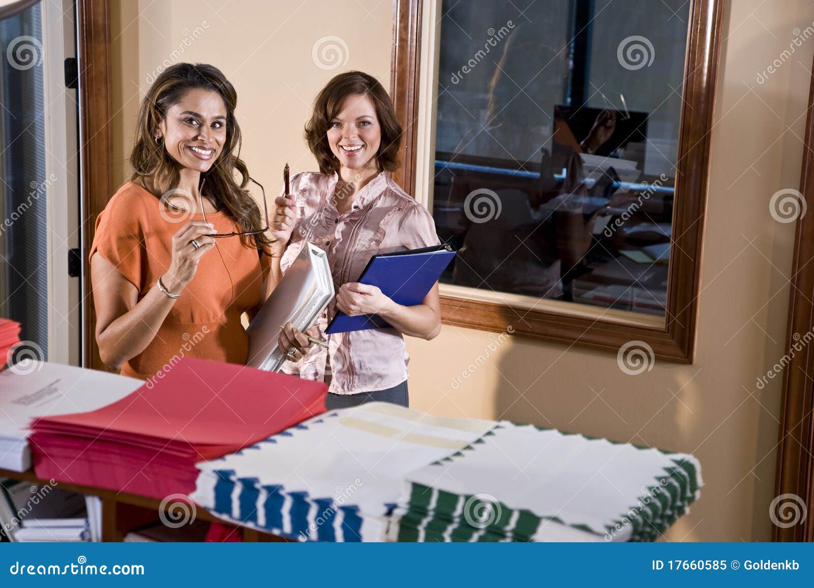 Female Office Workers Standing in Mailroom Stock Image - Image of real ...