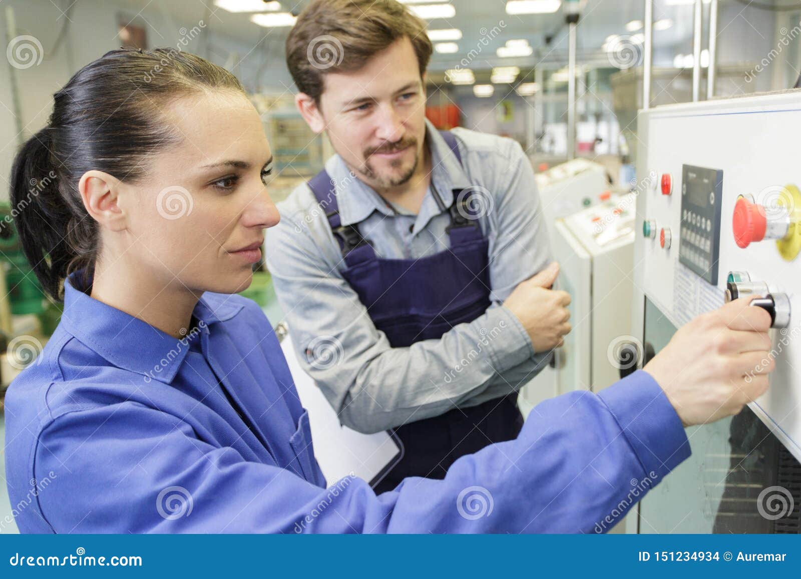 Female Operative Turning Switch on Machinery Controls Stock Photo ...