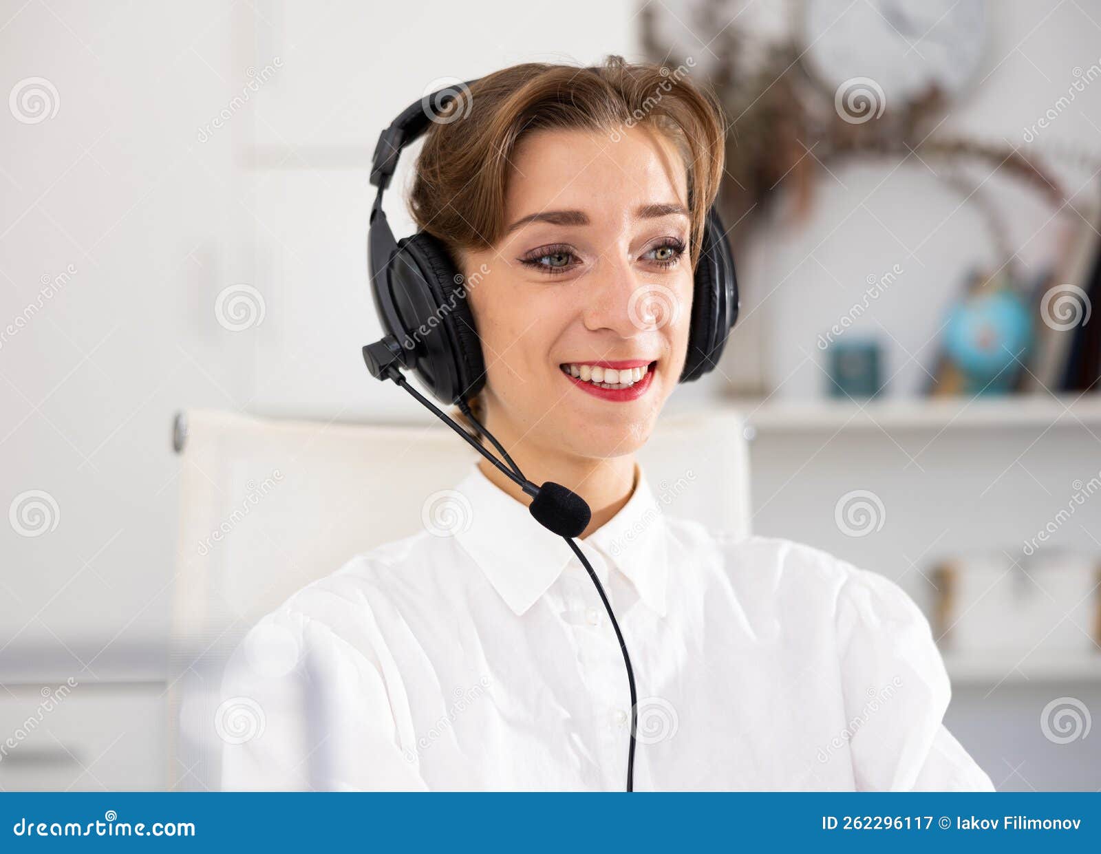Female Operator Talking with Customer Using Headset at Company Office ...