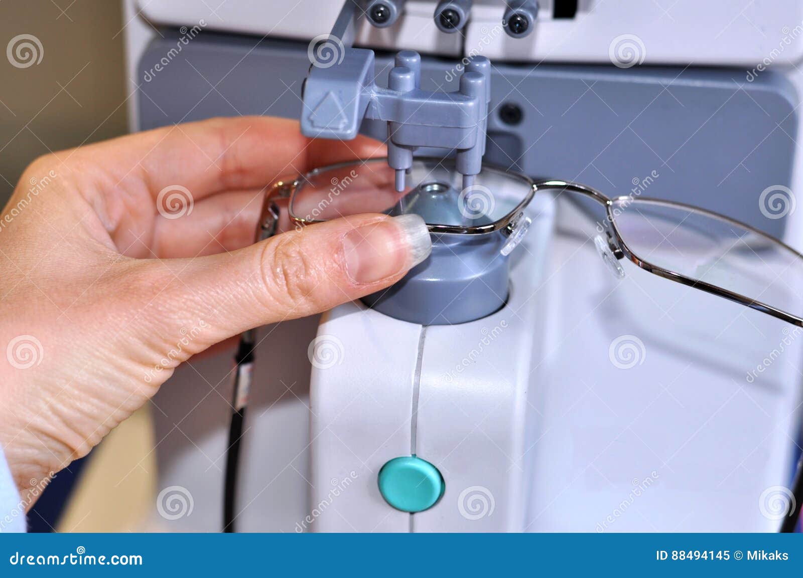 Female Optician Measuring and Preparing Glasses on the Digital Device ...