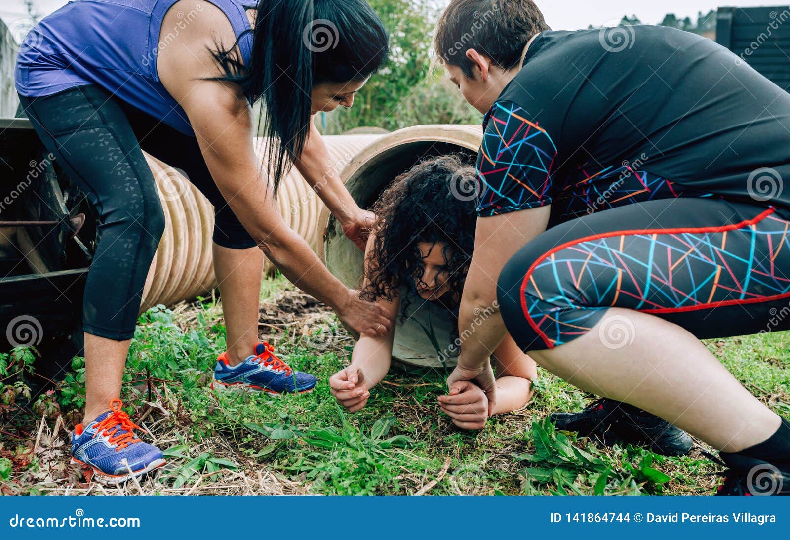 Participants Obstacle Course Going through a Pipe Stock Photo - Image ...
