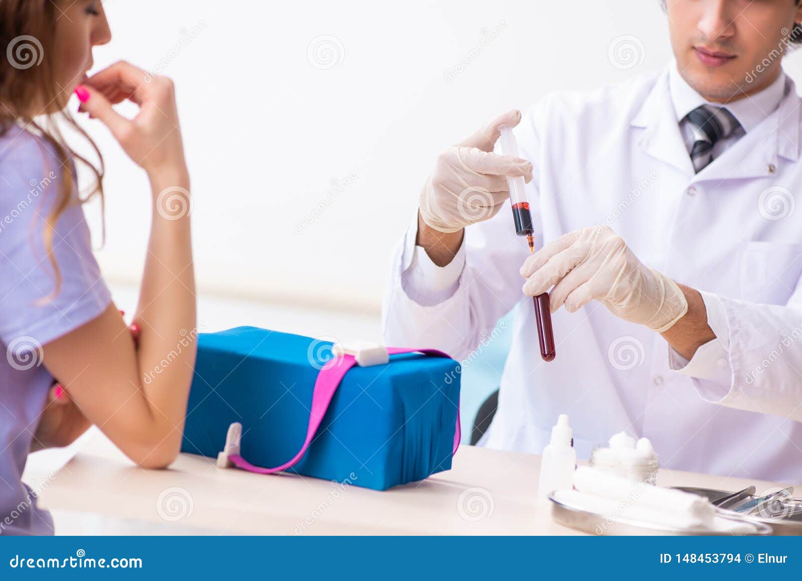 The Female Patient during Blood Test Sampling Procedure Stock Photo ...