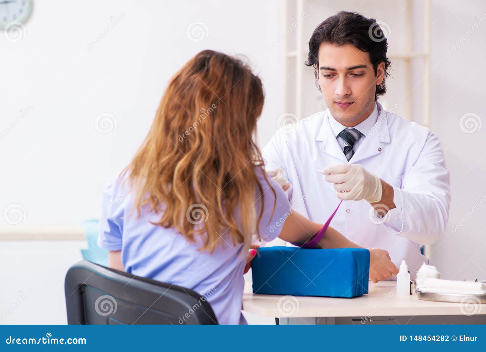 The Female Patient during Blood Test Sampling Procedure Stock Photo ...