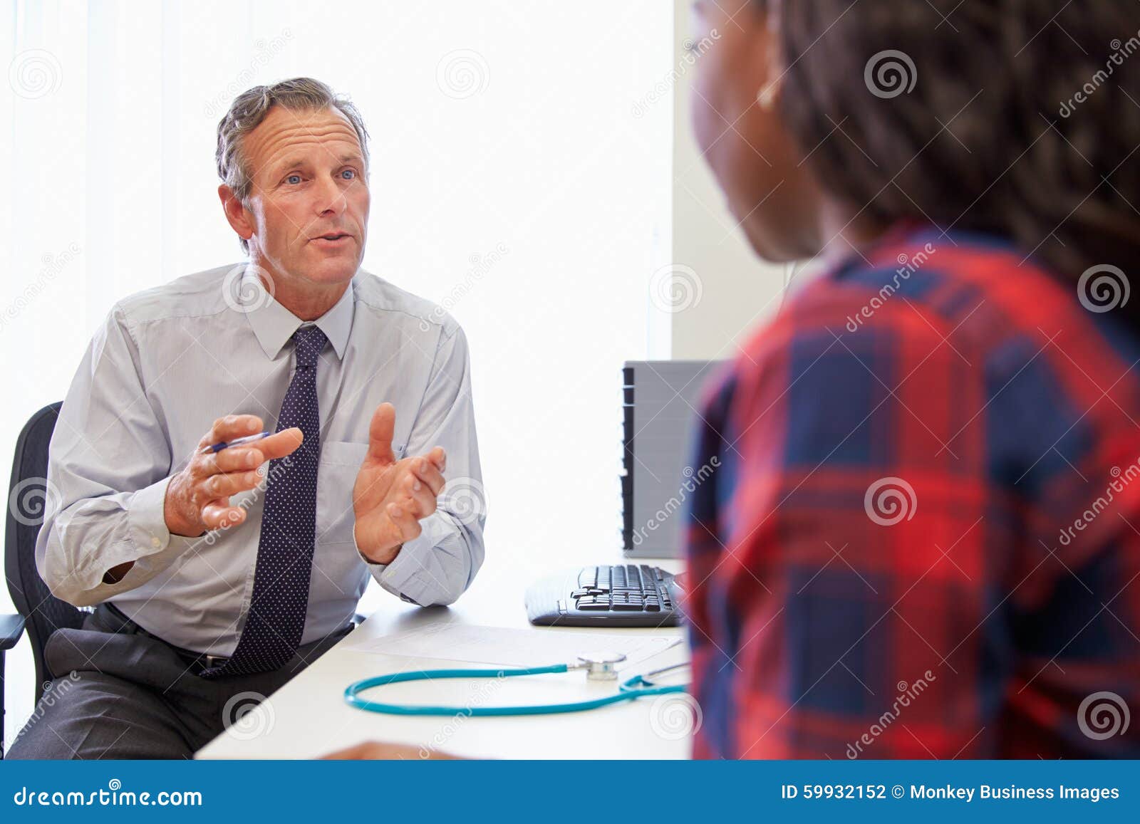 Female Patient Having Consultation with Doctor in Office Stock Photo ...
