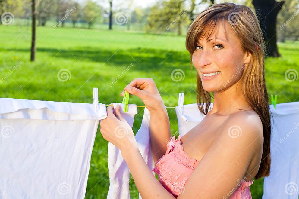 Female peg out washing stock photo. Image of green, housework - 14091914