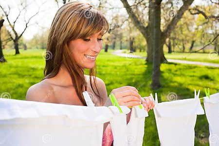 Female peg out washing stock image. Image of laundry - 14091955