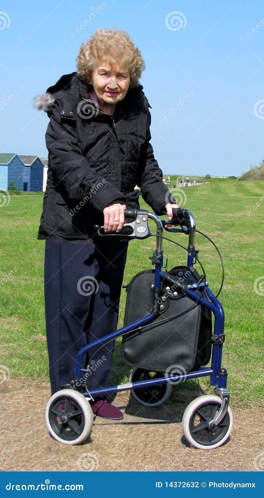 Senior Man Using Walking Frame In Physiotherapy Gym Stock