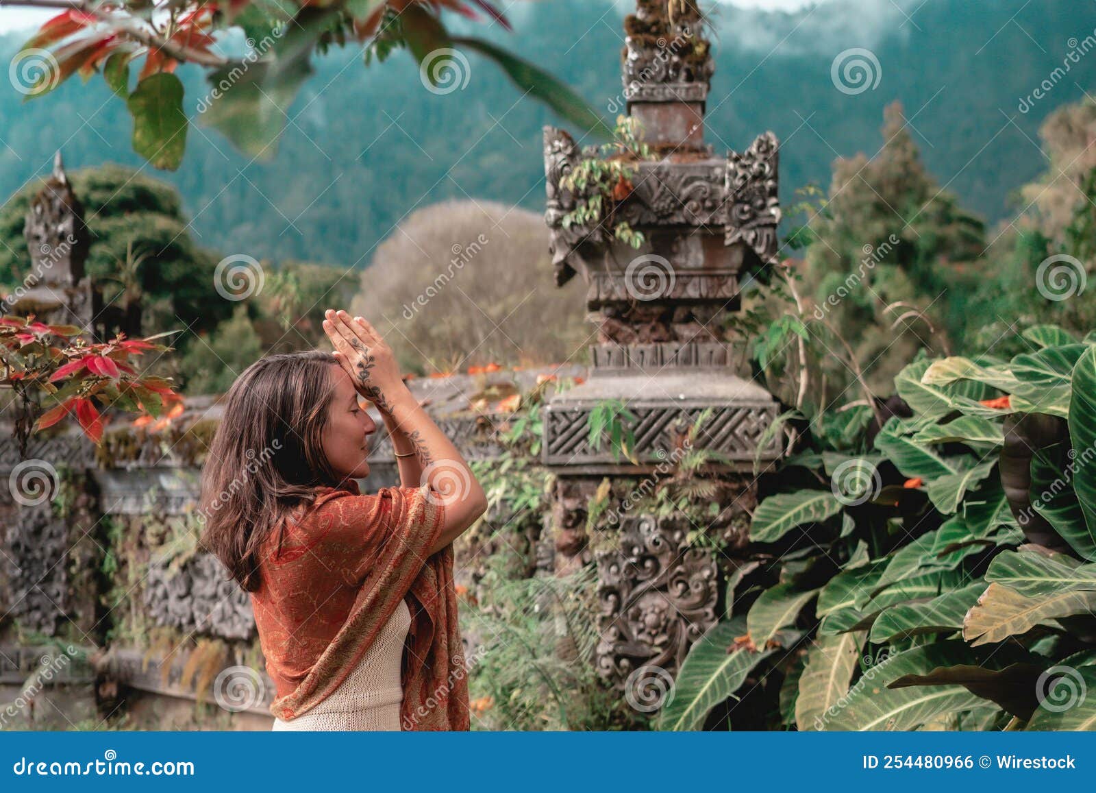 Female Performing Hindu Ritual in Ancient Bali Temple Stock Photo ...
