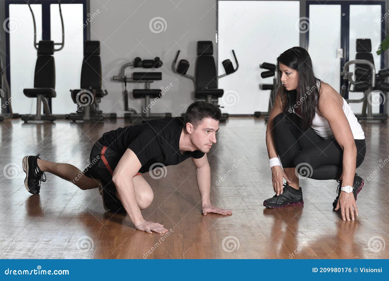 Female Personal Trainer Working with Her Trainee Stock Photo - Image of ...