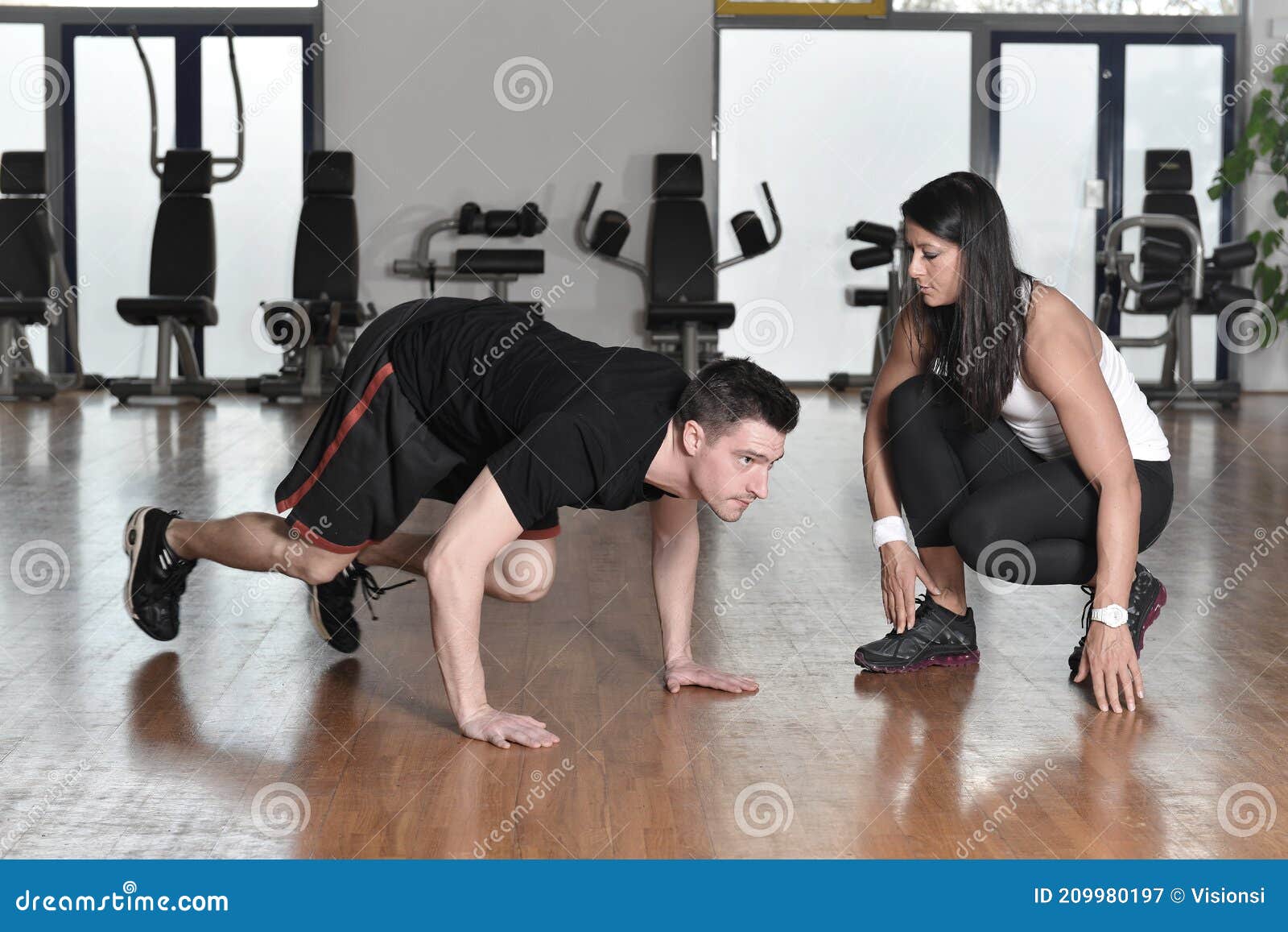 Female Personal Trainer Working with Her Trainee Stock Image - Image of ...