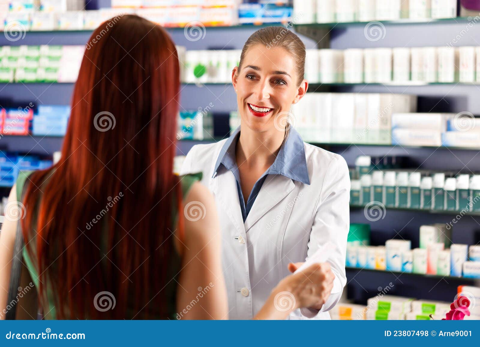 Female Pharmacist in Her Pharmacy with a Client Stock Photo - Image of ...