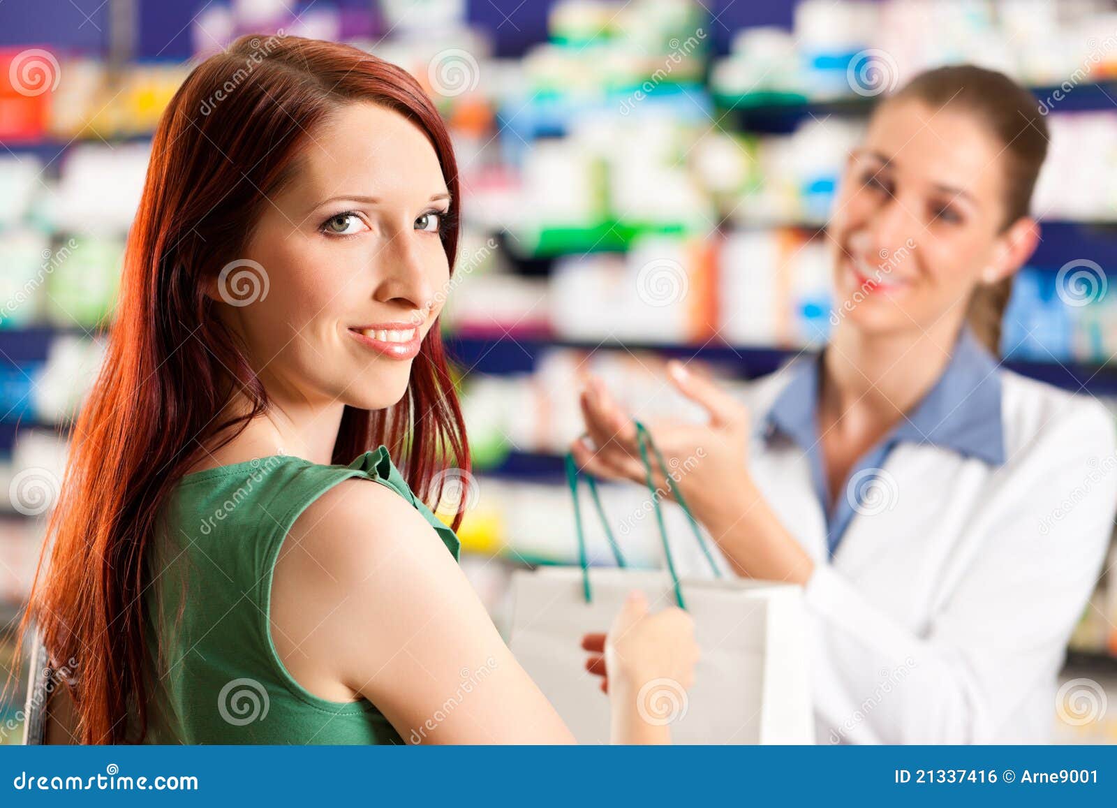 Female Pharmacist in Her Pharmacy with a Customer Stock Photo - Image ...