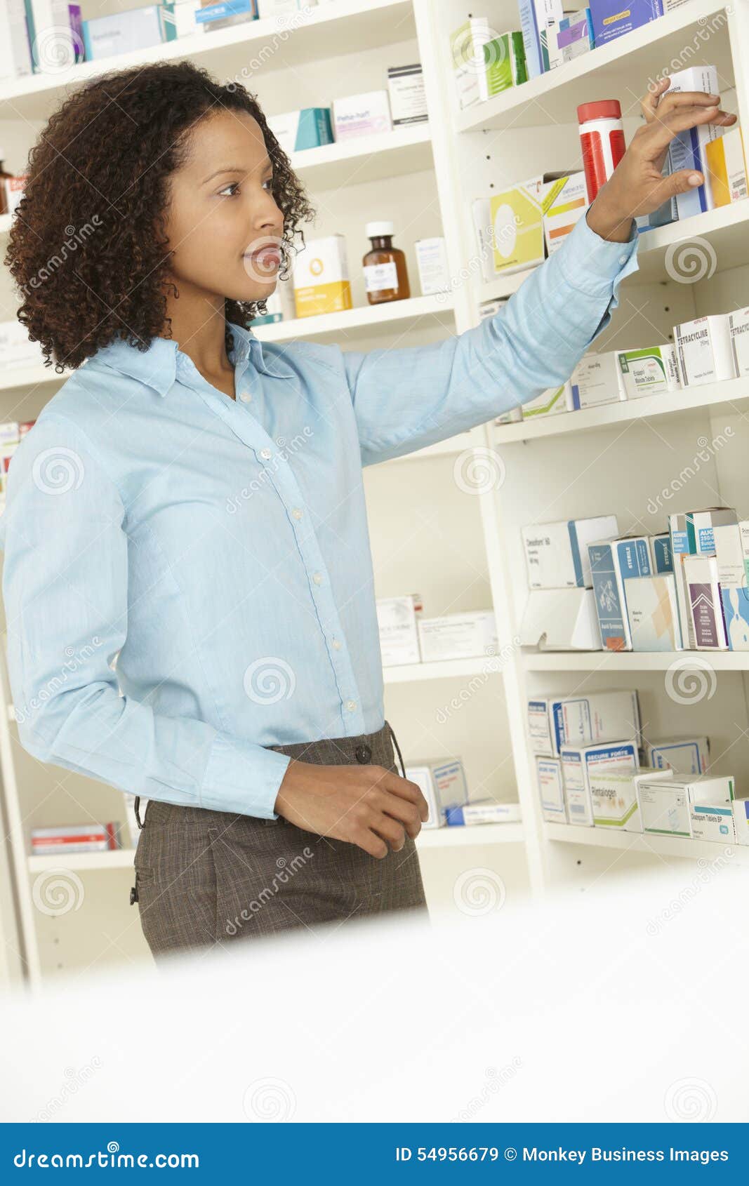 Female Pharmacist Working in UK Pharmacy Stock Image - Image of length ...