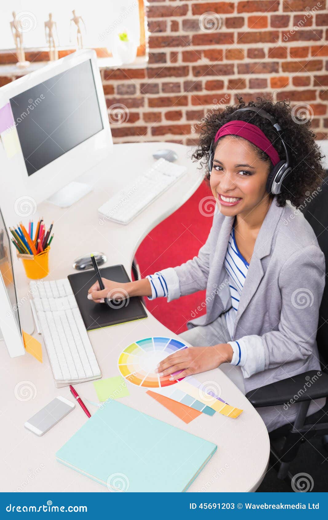 Female Photo Editor Using Digitizer in Office Stock Image - Image of ...
