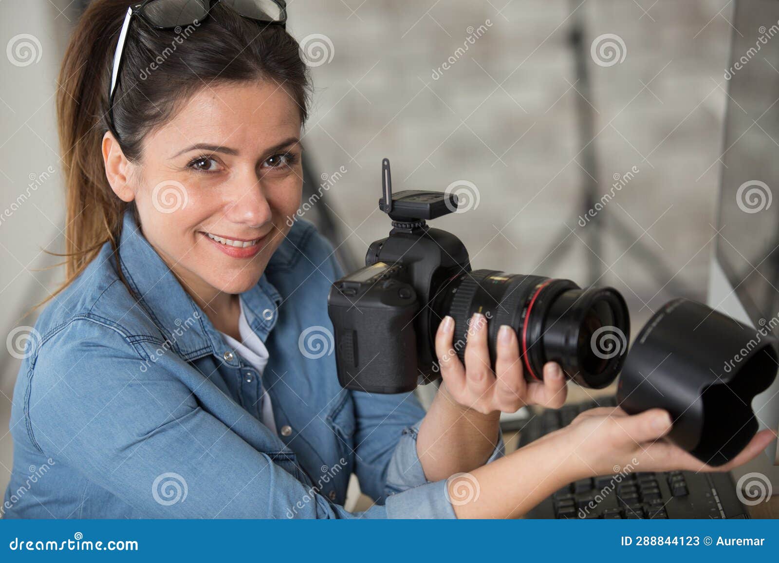 Female Photographer Adding Lens Attachment To Camera Stock Image ...