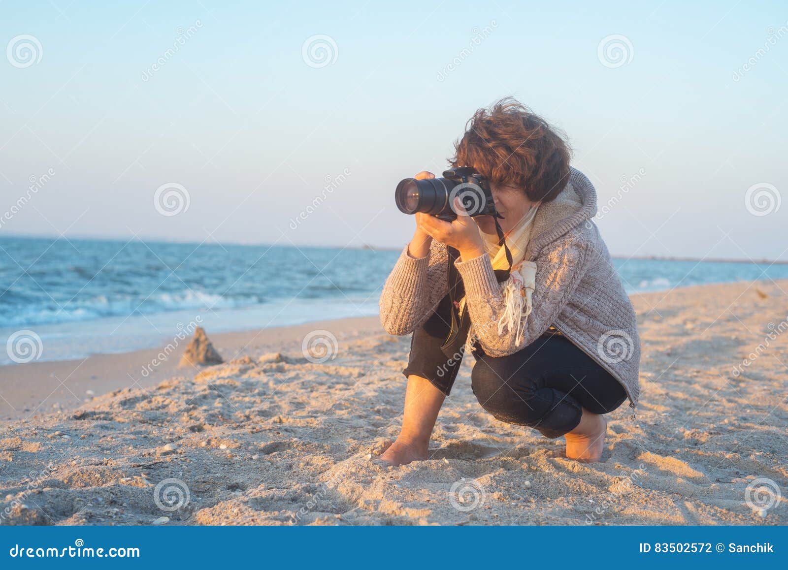 Female Photographer on the Beach Stock Photo - Image of hair ...