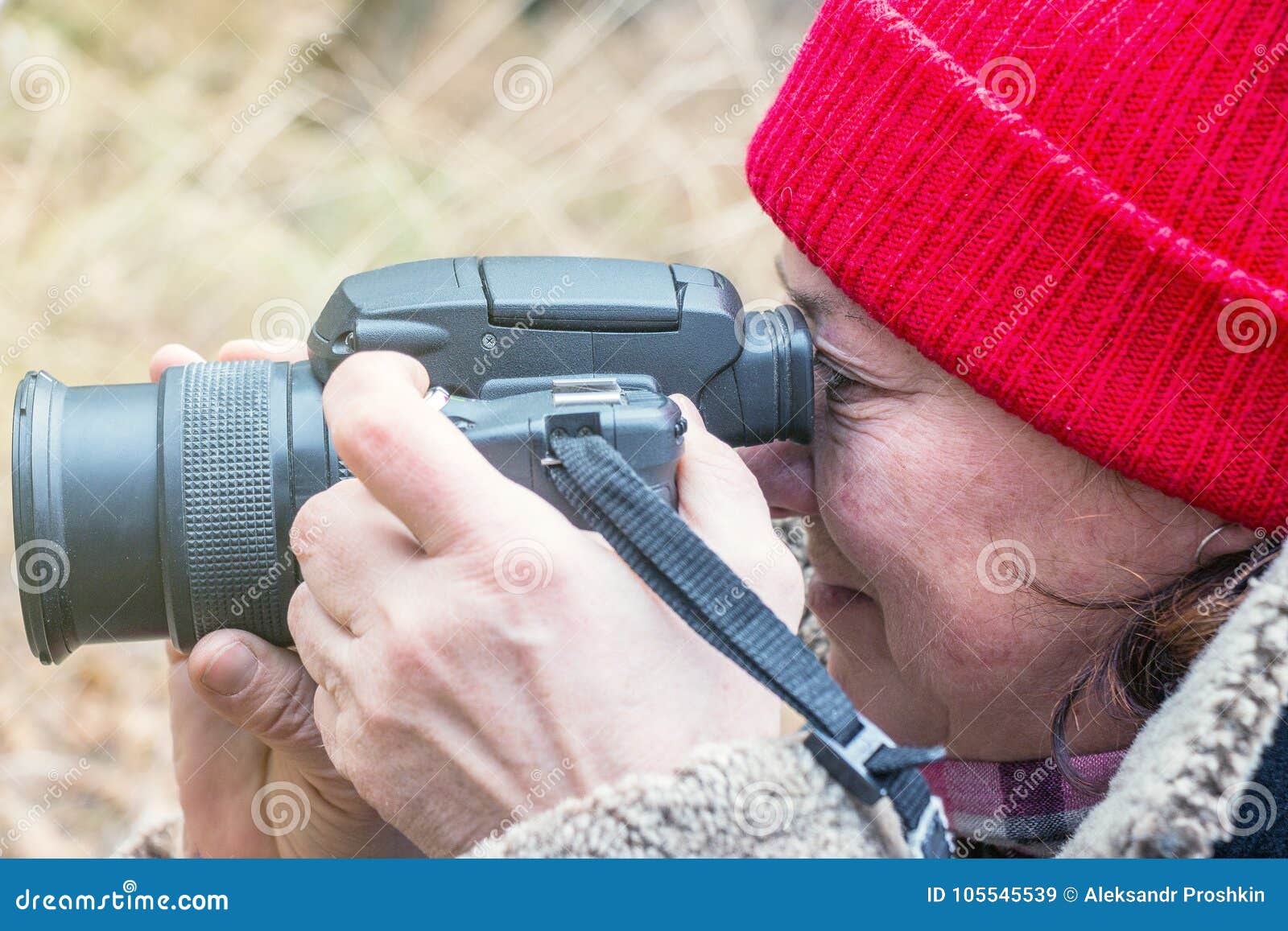 Female Photographer Looking in Viewfinder Stock Image - Image of ...