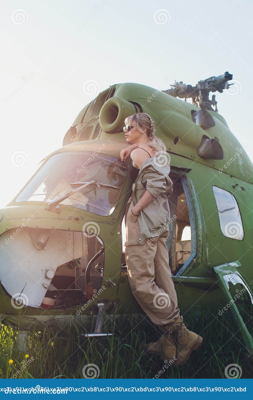 Female Pilot in Cockpit of Helicopter before Take Off. Young Woman ...