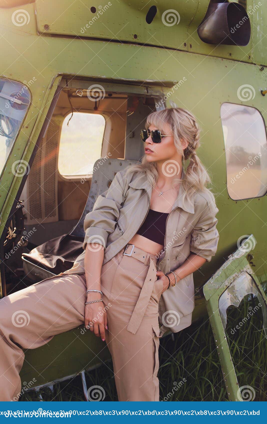 Female Pilot in Cockpit of Helicopter before Take Off. Young Woman ...