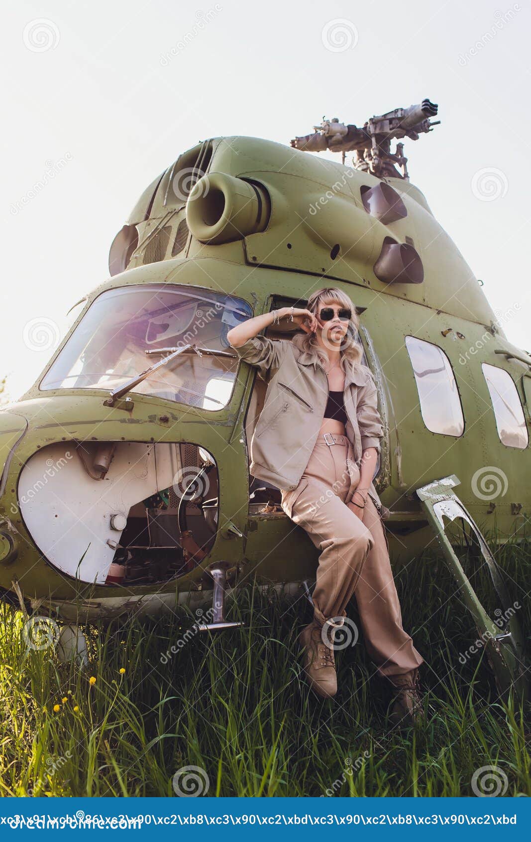 Female Pilot in Cockpit of Helicopter before Take Off. Young Woman ...
