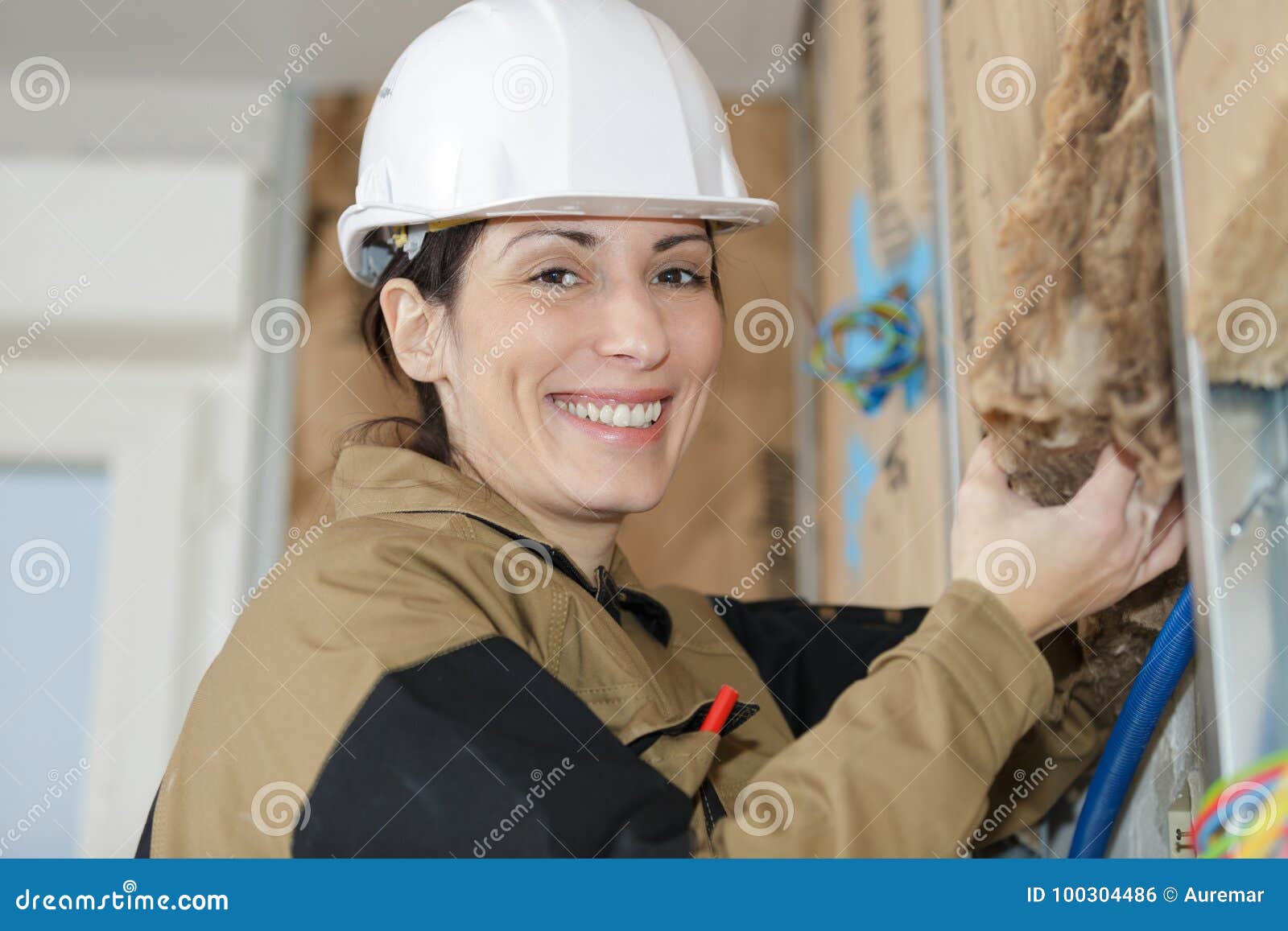 Female Plasterer Removing Material Stock Photo - Image of saving ...