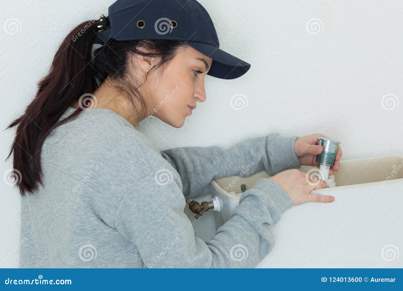 Female Plumber Fixing Toilet Flush Stock Photo - Image of handyman ...