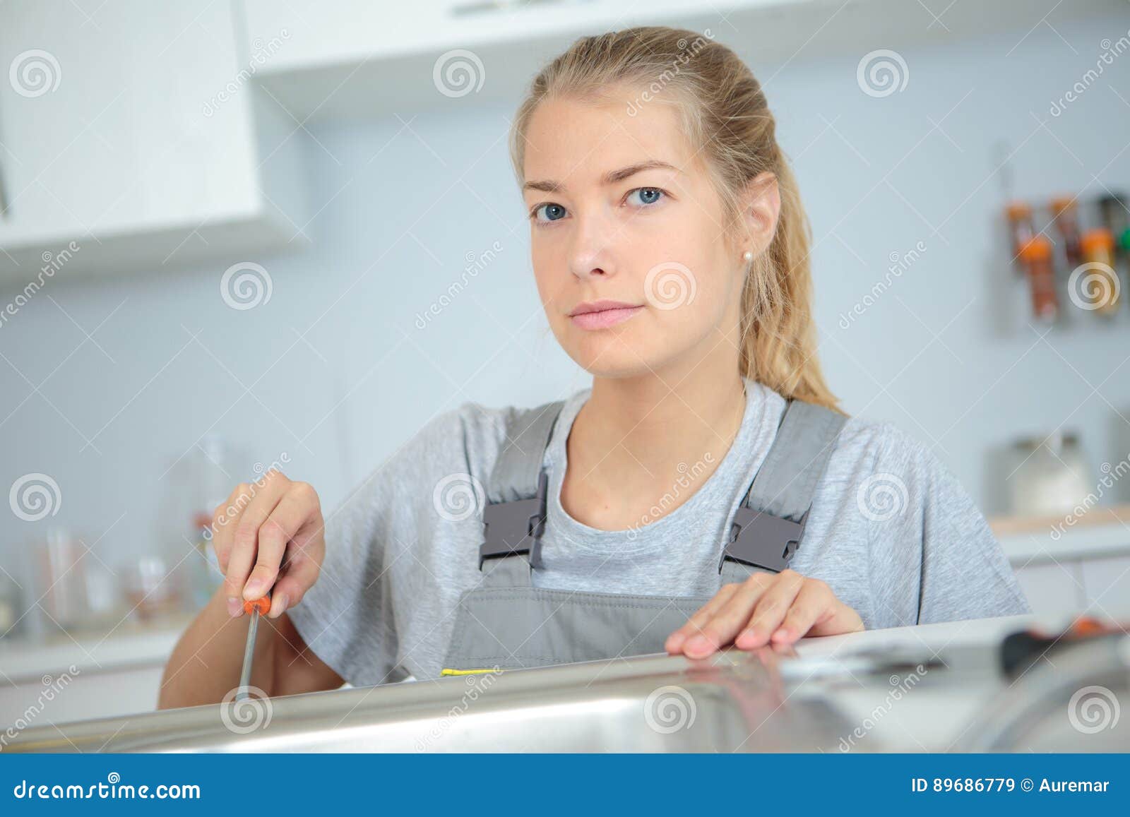 Female Plumber Repairing Sink Stock Image - Image of work, worker: 89686779