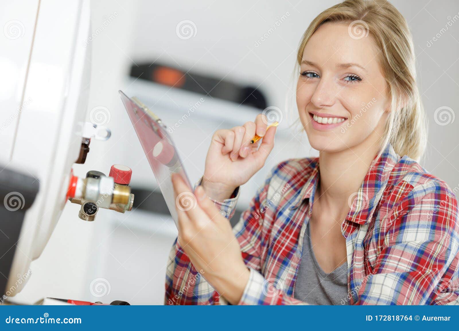 Female Plumber Working on Central Heating Boiler Stock Photo - Image of ...