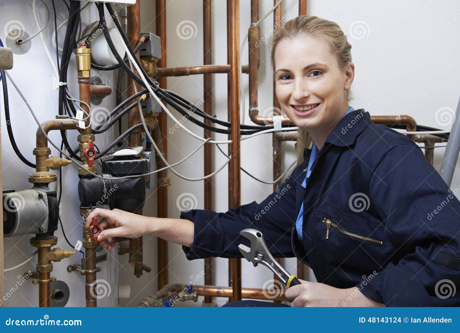 Female Plumber Working on Central Heating Boiler Stock Photo - Image of ...