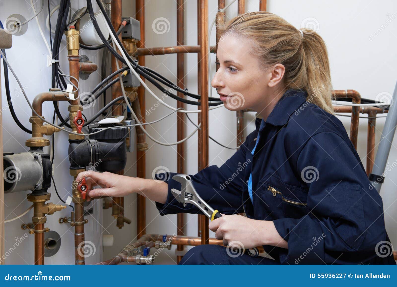Female Plumber Working on Central Heating Boiler Stock Image - Image of ...